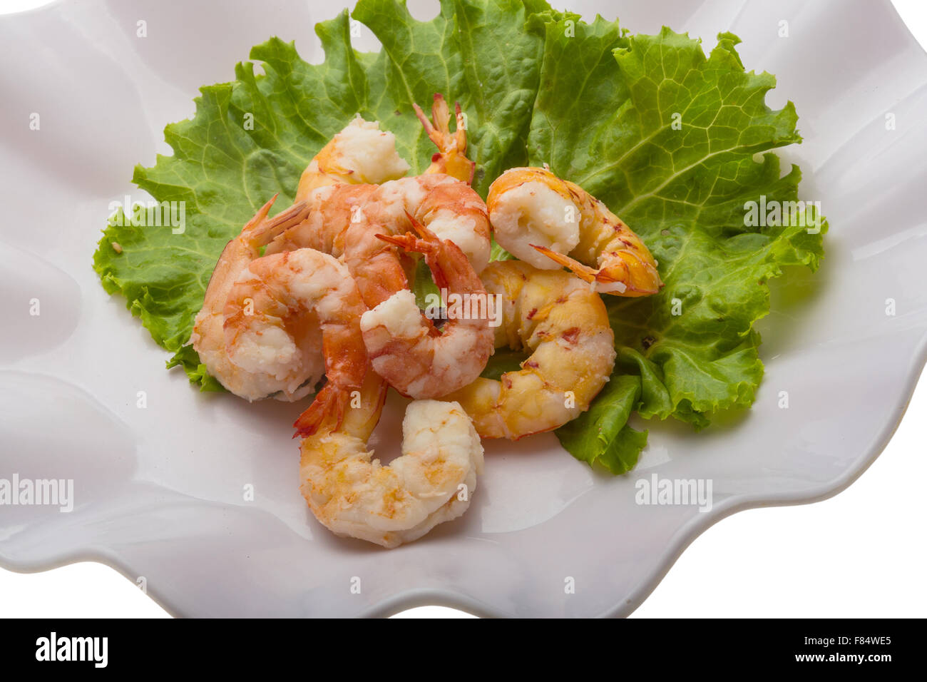 Unshelled king prawn heap with salad leaves Stock Photo - Alamy