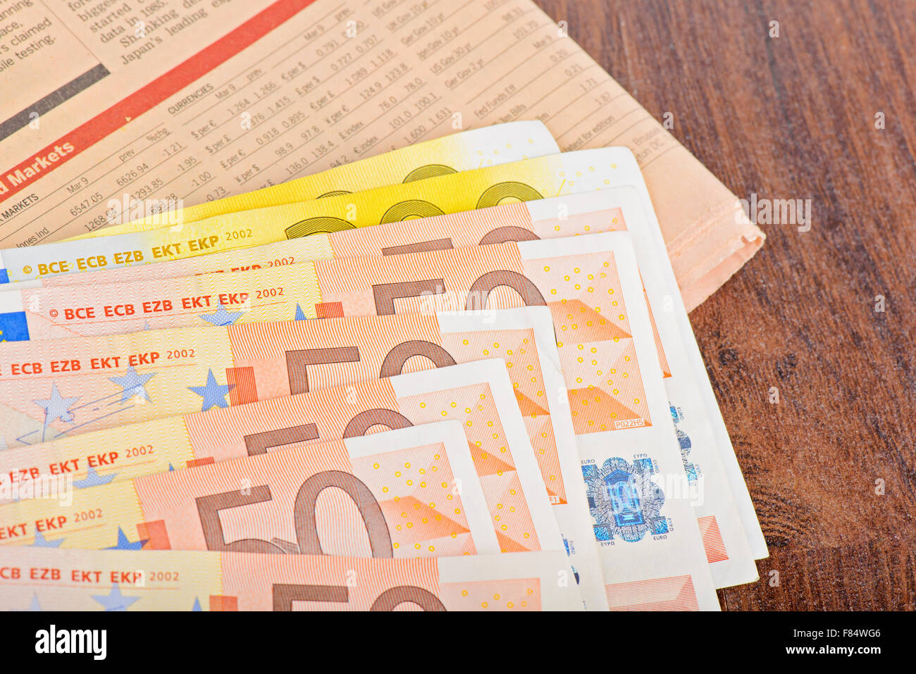 Close-up of Euro banknotes with newspaper Stock Photo - Alamy