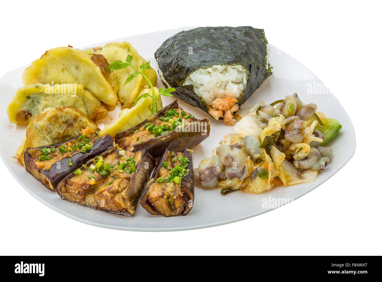 Japan traditional food - rice ball, gyoza, eggplant and octopus salad ...