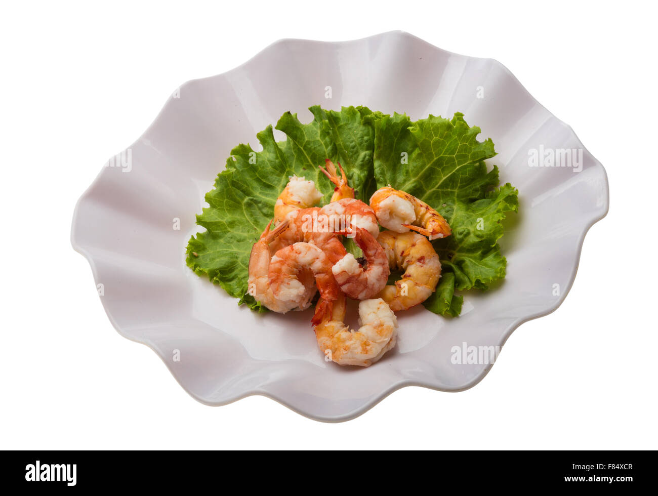 Unshelled king prawn heap with salad leaves Stock Photo - Alamy