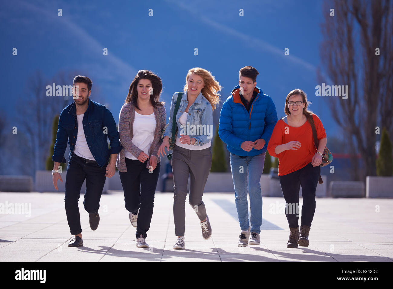 happy students group have fun outdoor in university campus park Stock ...