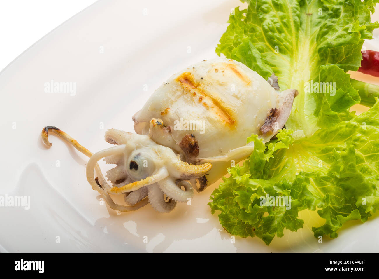 Grilled cuttlefish with salad and pepper Stock Photo - Alamy