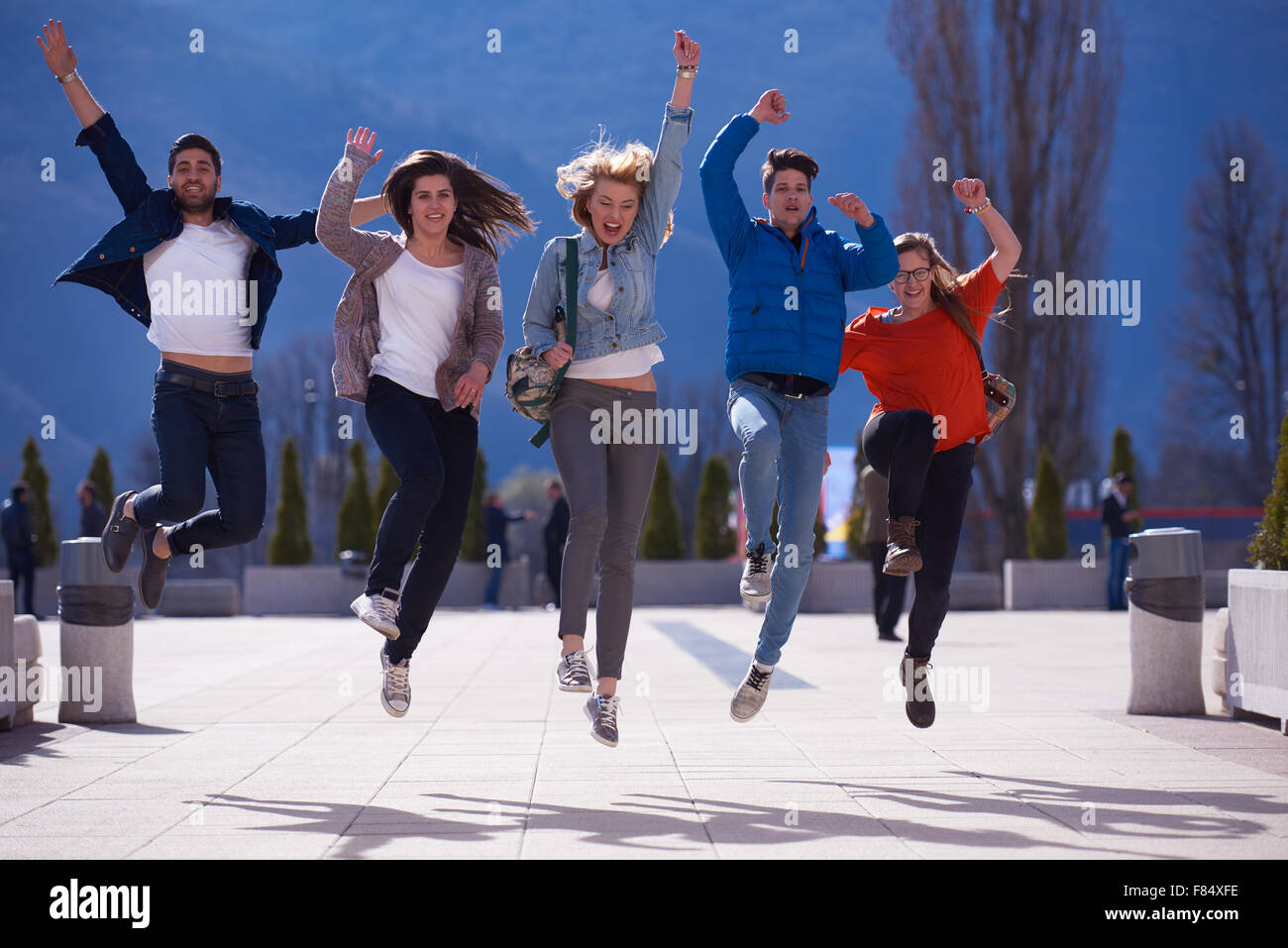 happy students group have fun outdoor in university campus park Stock ...