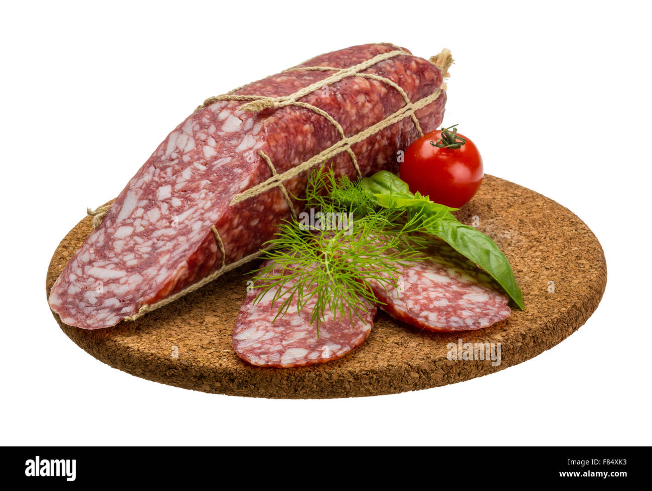 Salami sausages sliced with basil Stock Photo - Alamy