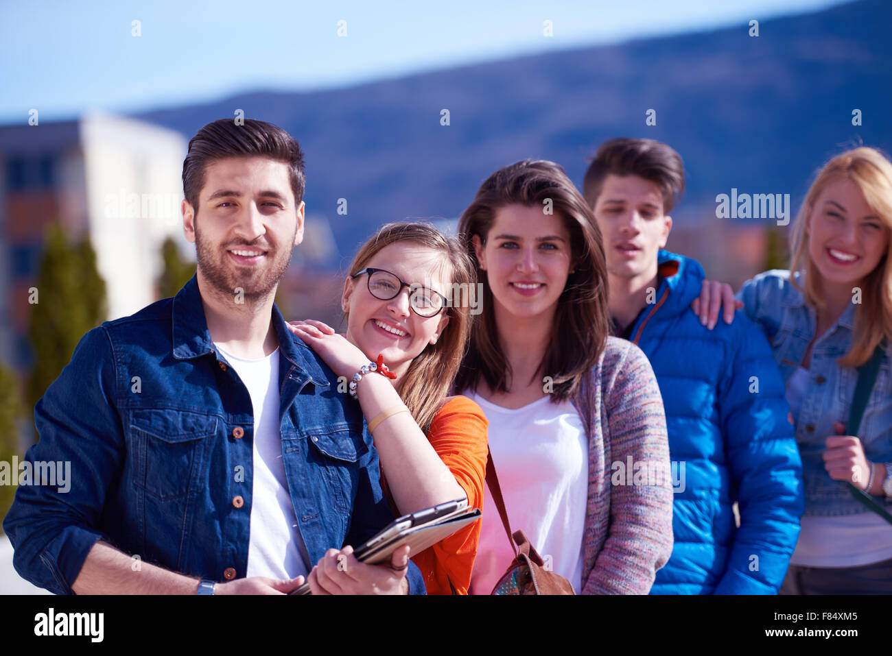 happy students group have fun outdoor in university campus park Stock ...