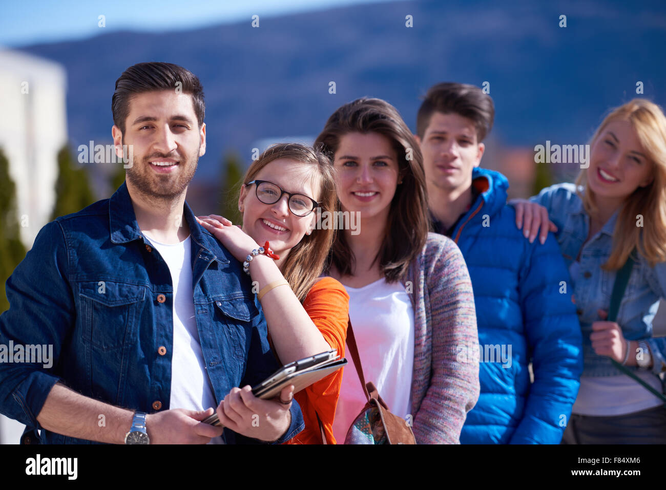 happy students group have fun outdoor in university campus park Stock ...
