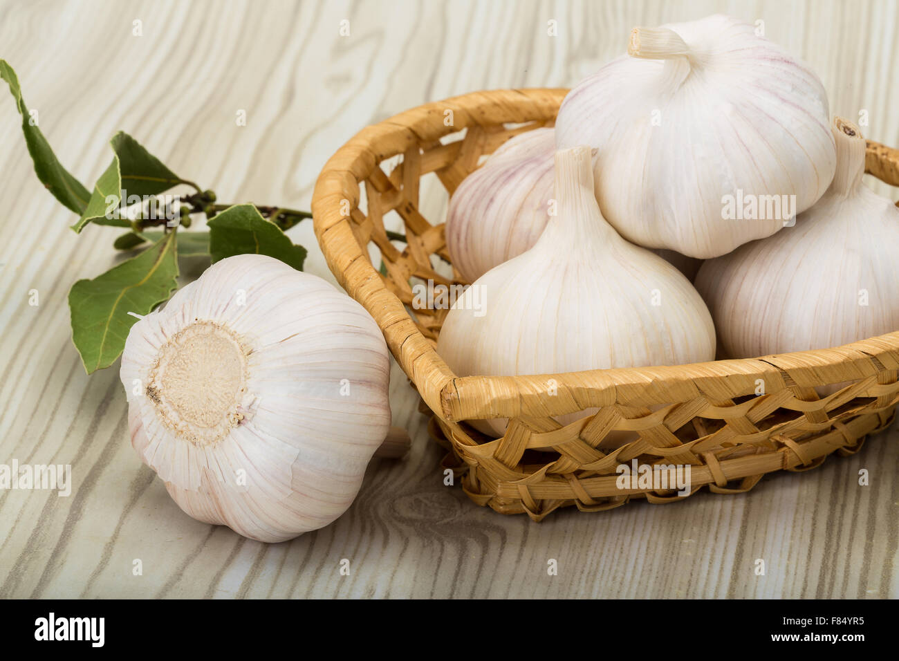Heap of garlick - on the wooden background Stock Photo - Alamy