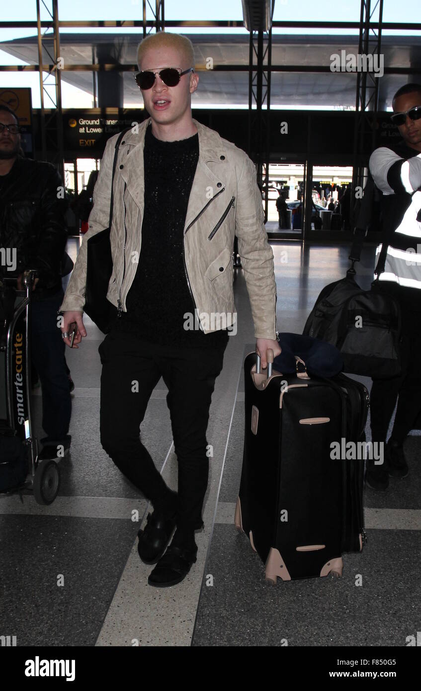 Albino model Shaun Ross departs on a flight from Los Angeles ...