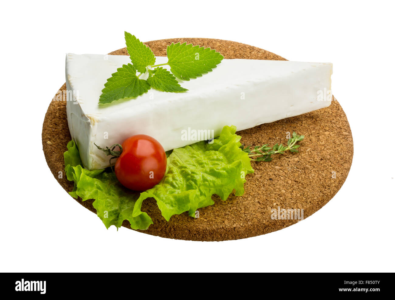 Brie cheese with thyme and salad leaves Stock Photo - Alamy