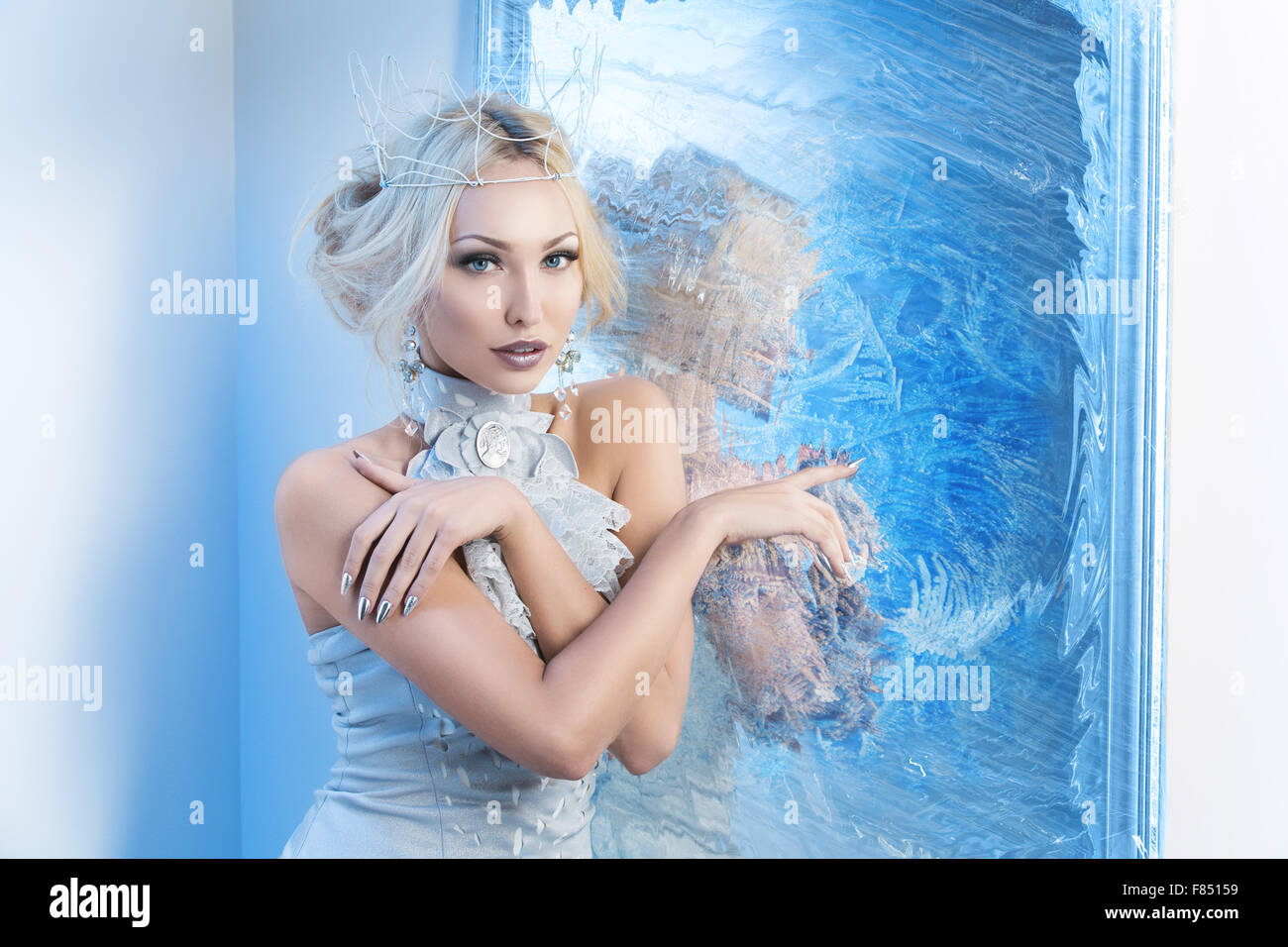 Snow queen near frozen mirror Stock Photo - Alamy
