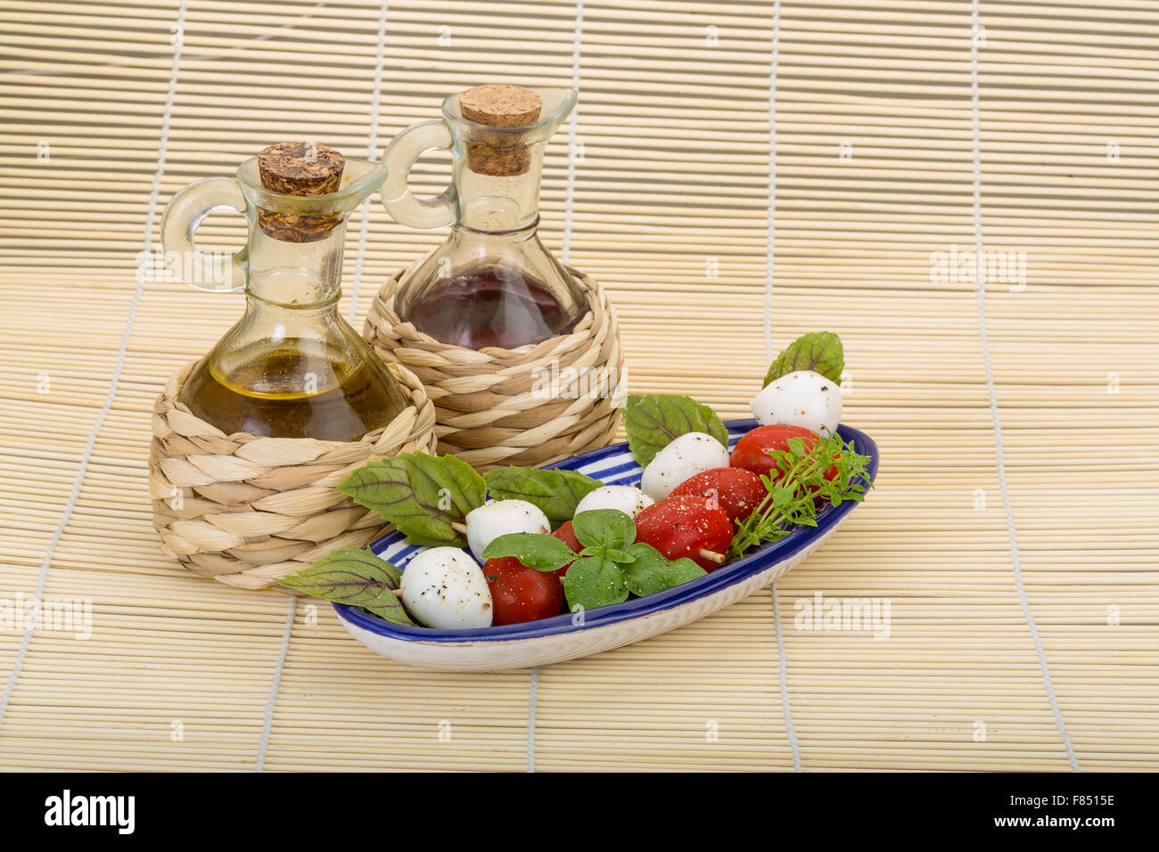 Famous italian caprese salad with fresh basil leaves Stock Photo - Alamy