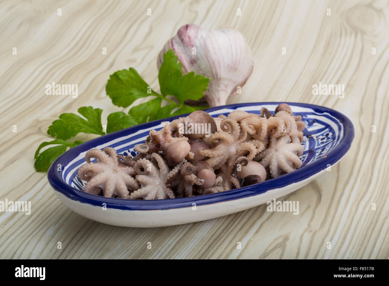 Boiled octopus - mini seafood in the bowl Stock Photo - Alamy