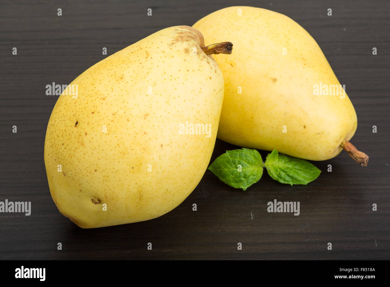 Bright ripe Yellow pears with mint leaves Stock Photo - Alamy