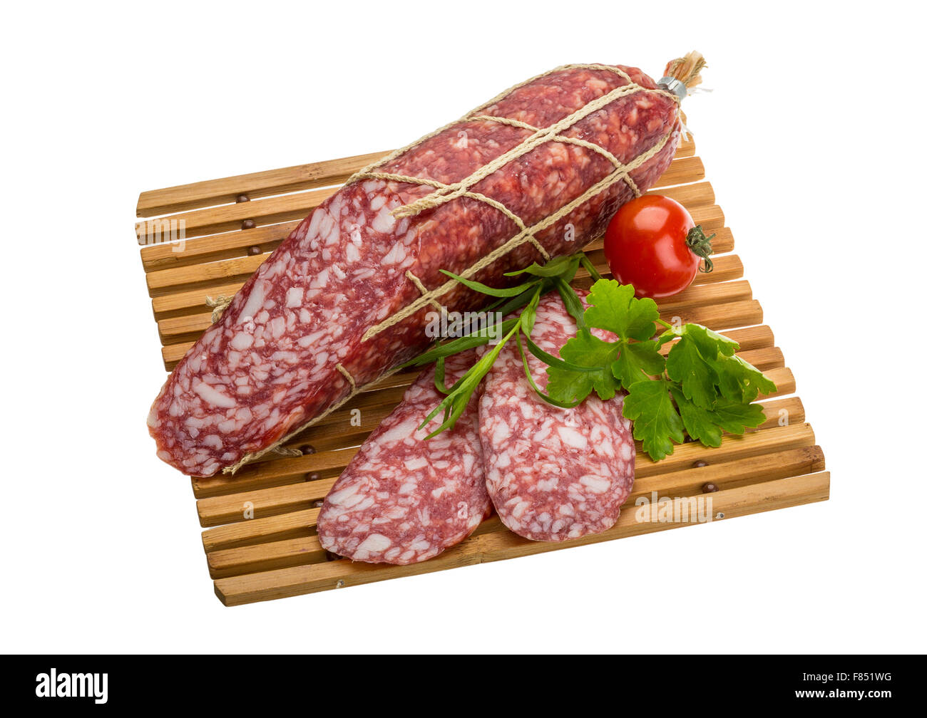 Salami sausages sliced with basil Stock Photo - Alamy