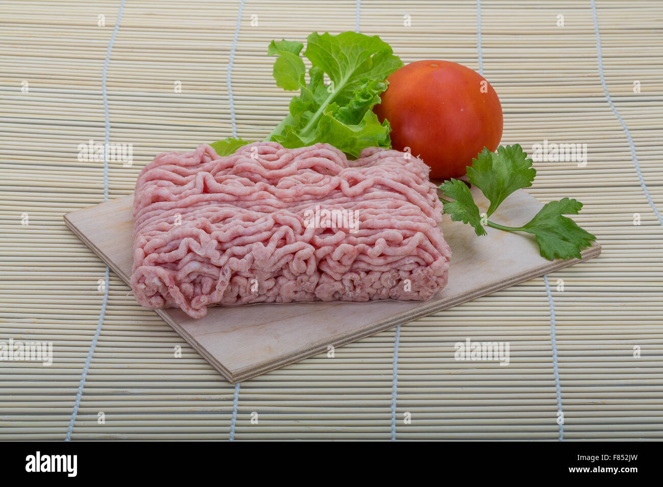 Raw minced pork meat on the desk with herbs Stock Photo - Alamy