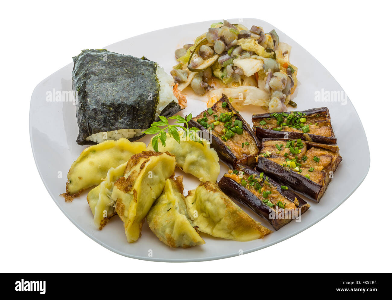Japan traditional food - rice ball, gyoza, eggplant and octopus salad ...