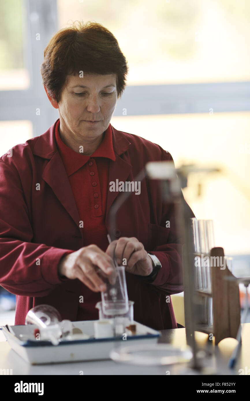 older or senior science and chemistry teacher woman portrait at ...