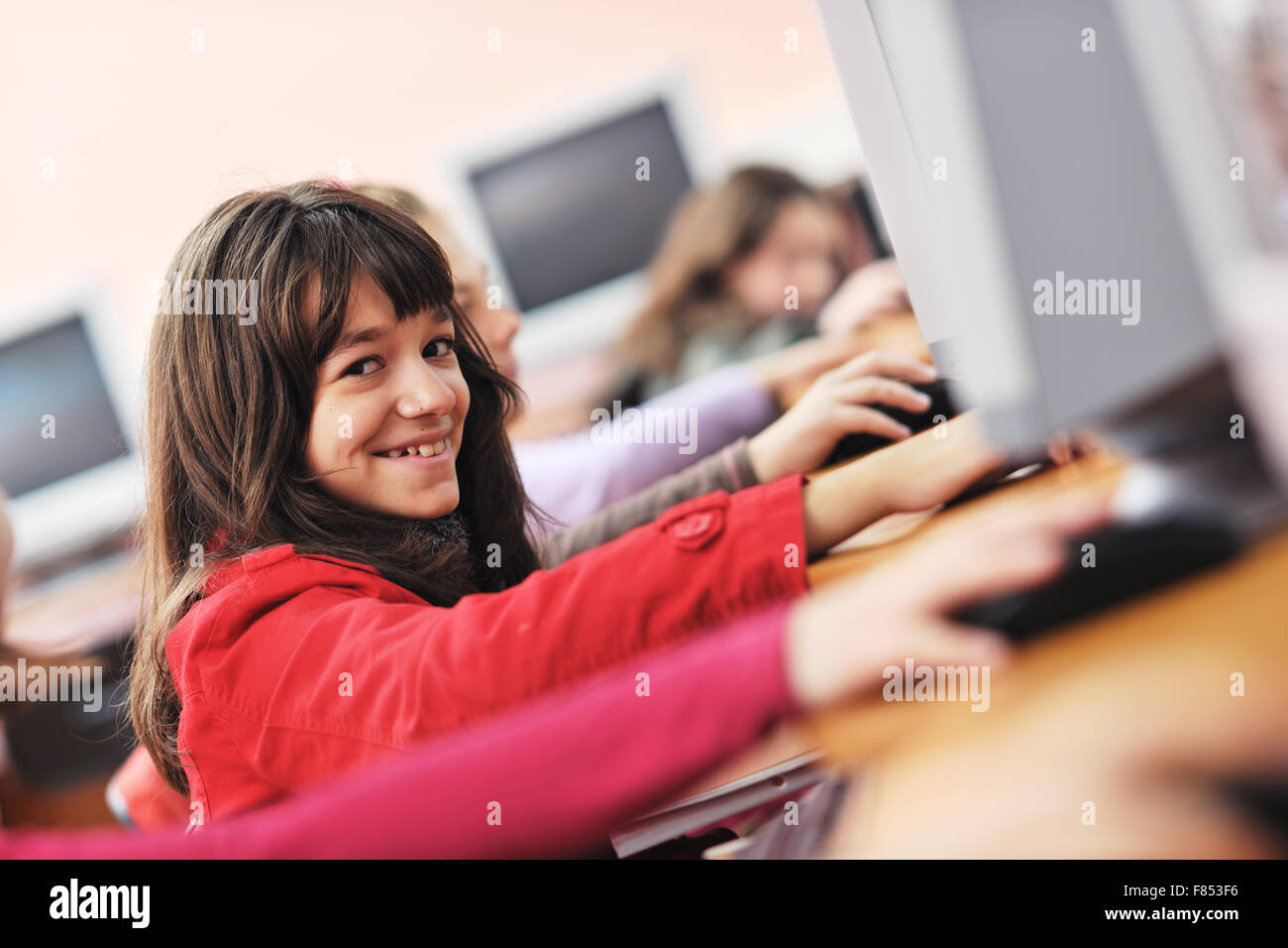 it education with children group in school at computer science class ...