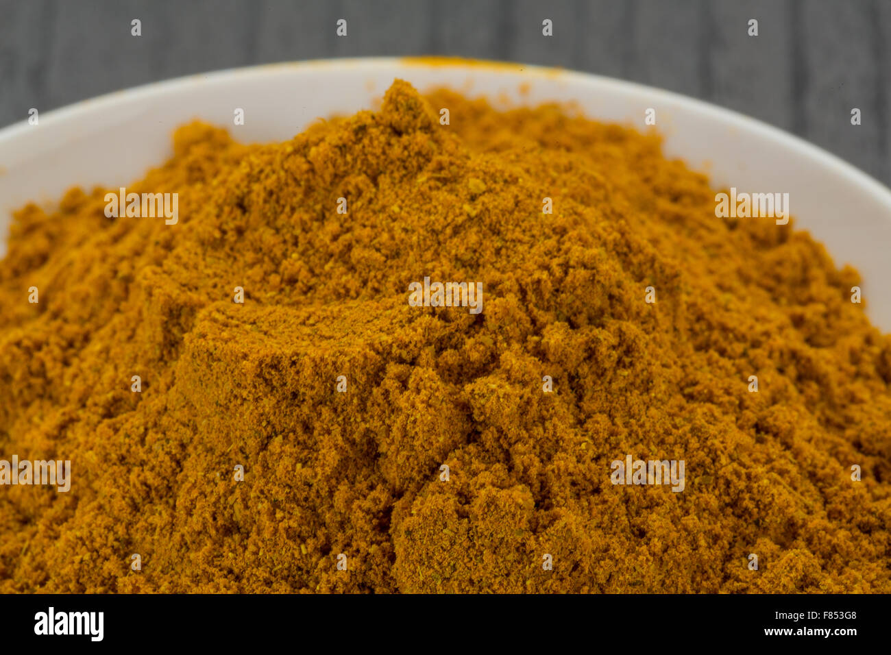 Curry powder in the bowl Stock Photo - Alamy