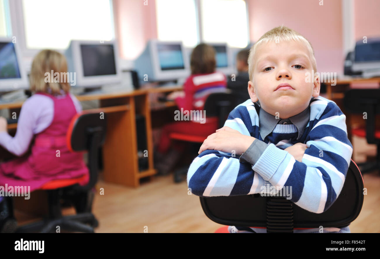 it education with children group in school at computer science class ...