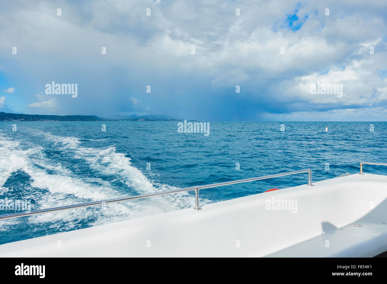 Looking out the back of a catamaran charter boat on the Caribbean sea ...