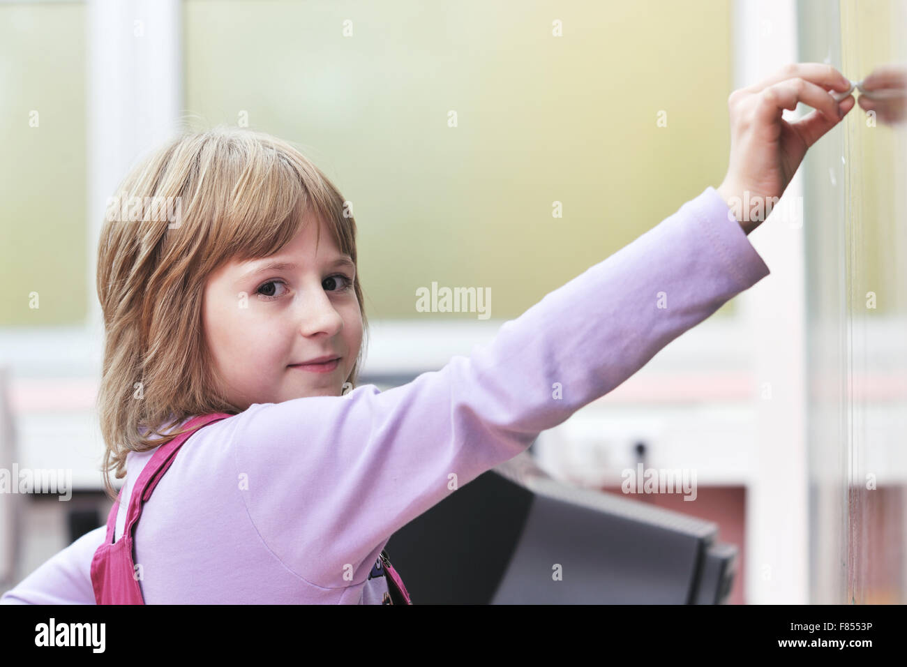 happy school girl on math classes finding solution and solving problems ...