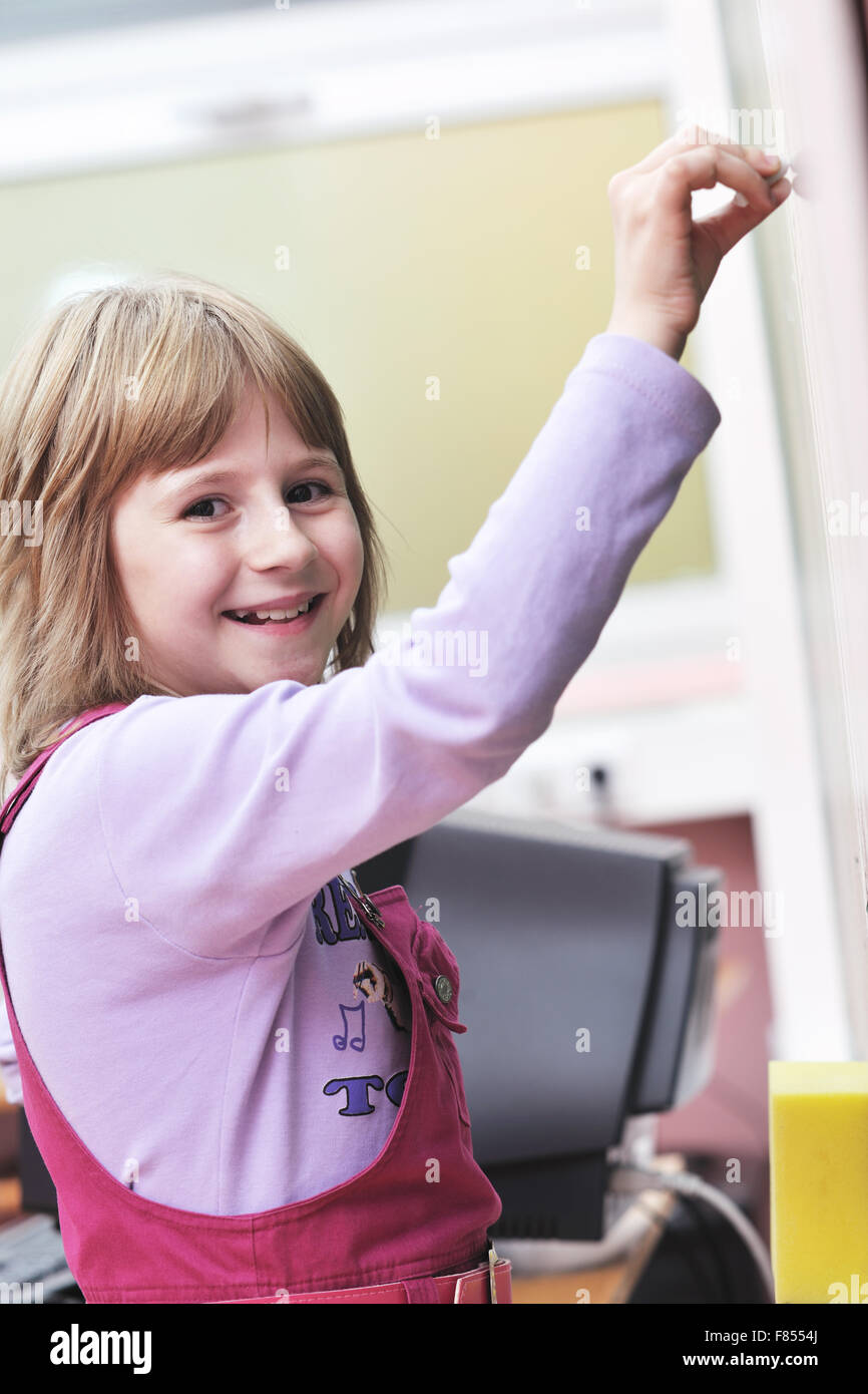 happy school girl on math classes finding solution and solving problems ...