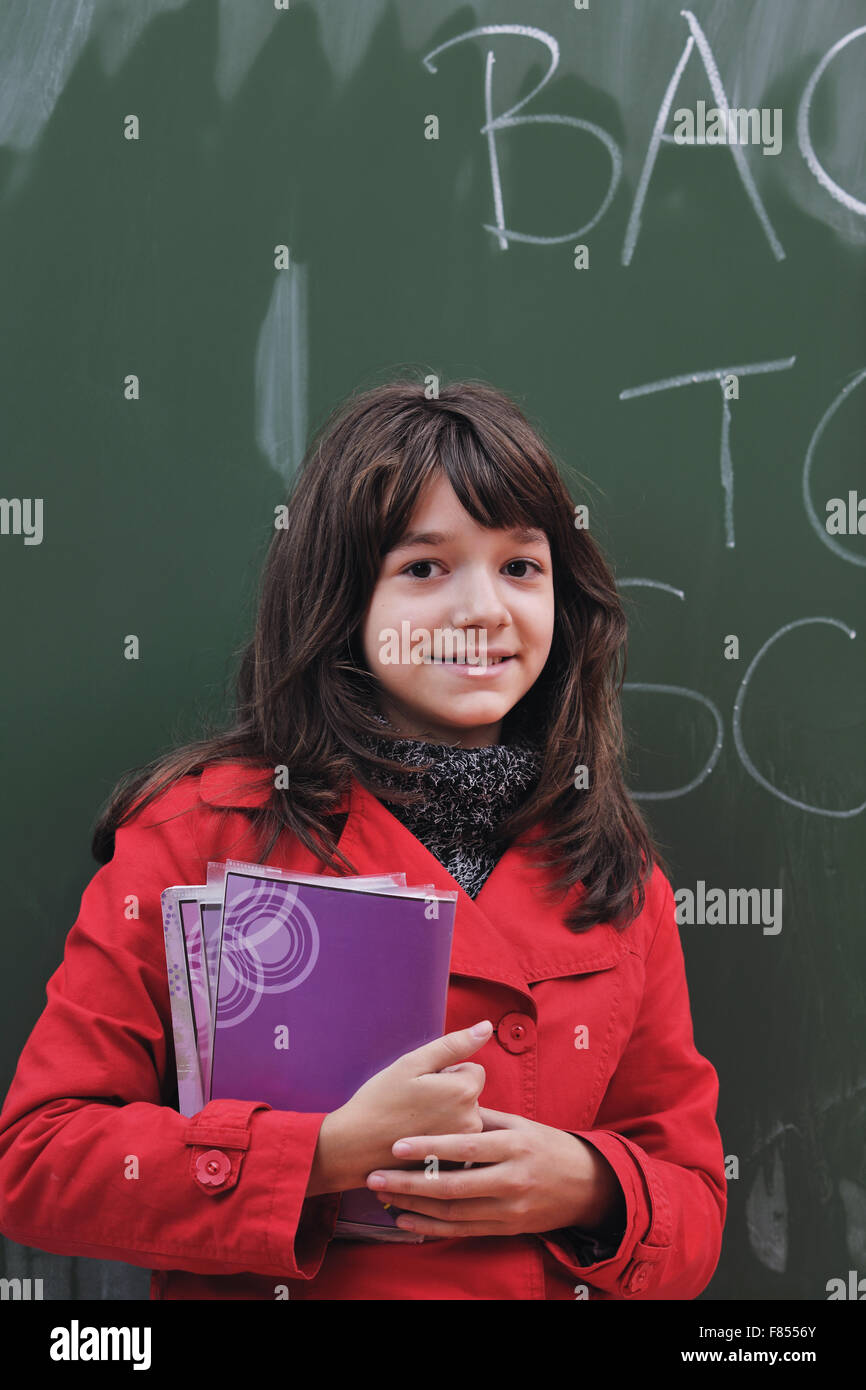 happy school girl on math classes finding solution and solving problems ...