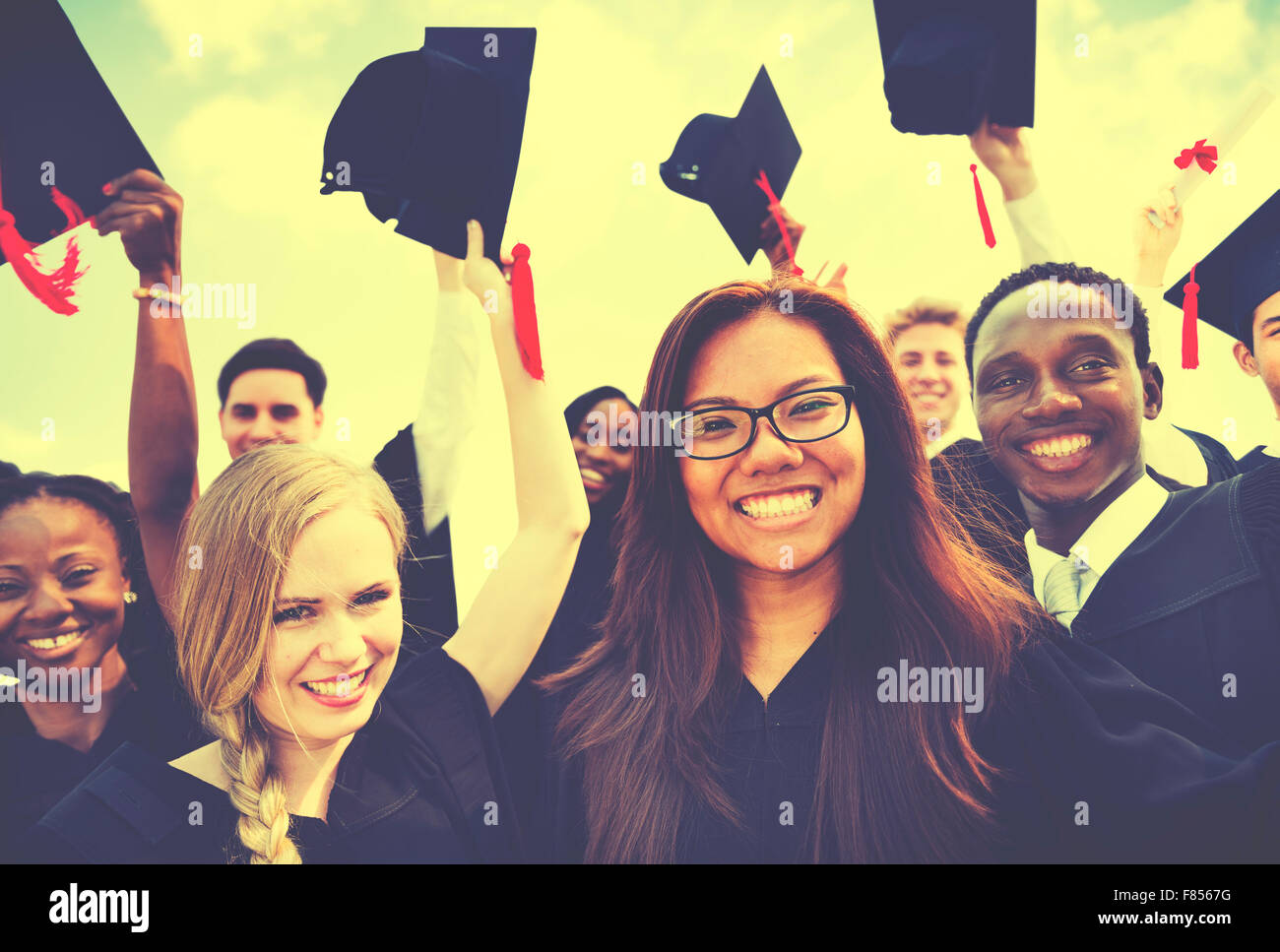 Group of Diverse Students Celebrating Graduation Concept Stock Photo ...