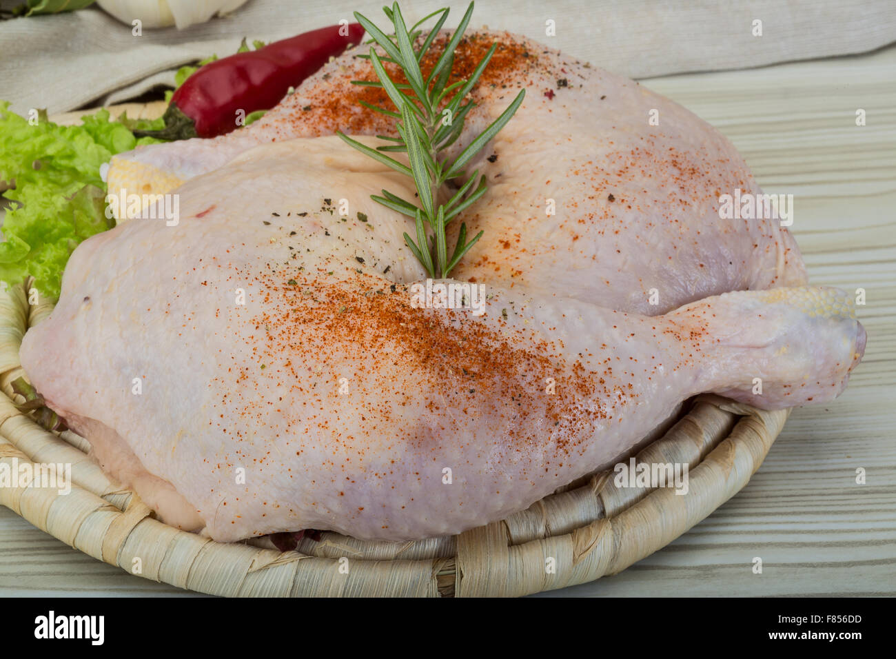 Chicken thigh with rosemary, pepper and salad leaves Stock Photo - Alamy