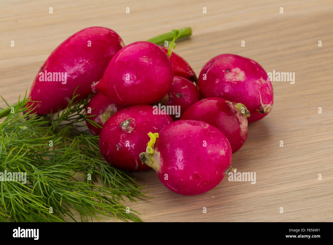 Radish with dill on the desk Stock Photo - Alamy