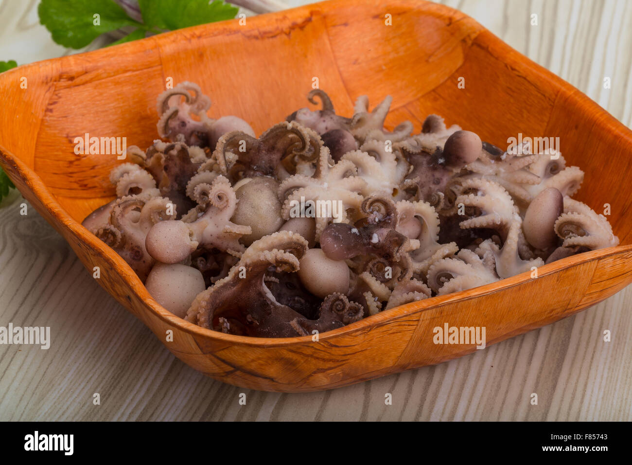 Boiled octopus - mini seafood in the bowl Stock Photo - Alamy