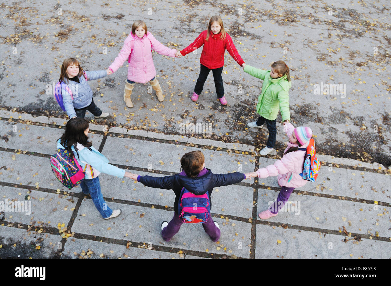 happy young child group outdoor standing together in circle formation ...