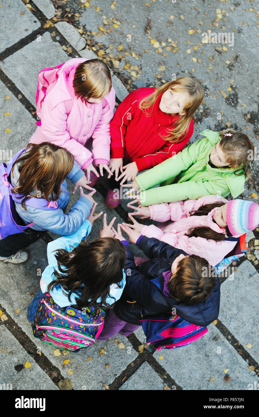 happy young child group outdoor standing together in circle formation ...