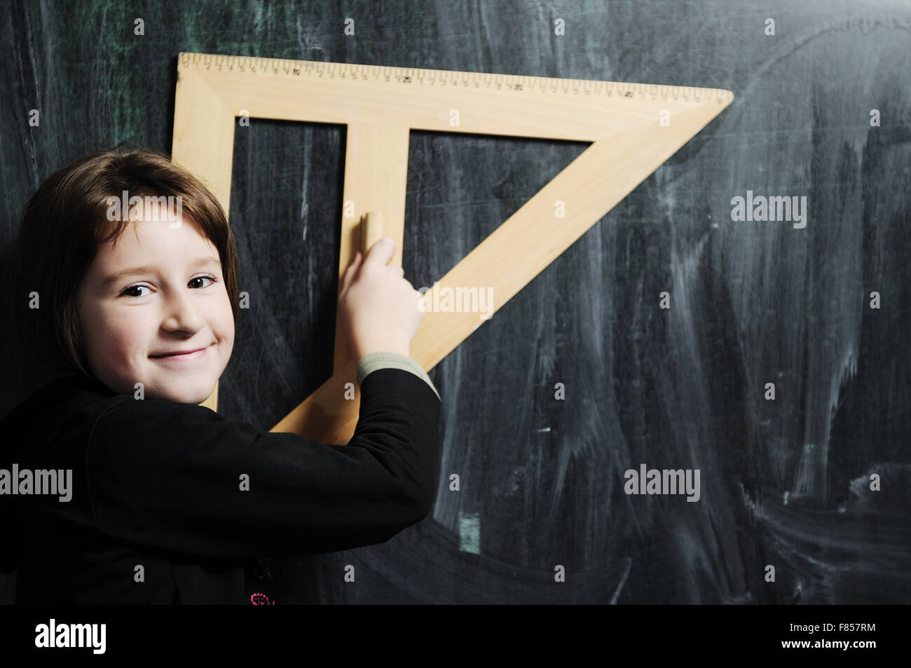 happy school girl on math classes finding solution and solving ...