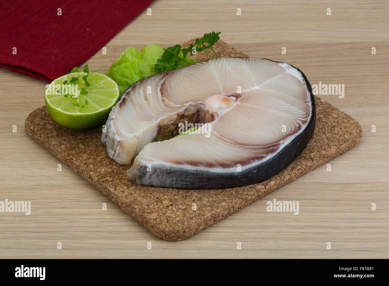 Raw blue shark steak with salad leaves and lime Stock Photo - Alamy
