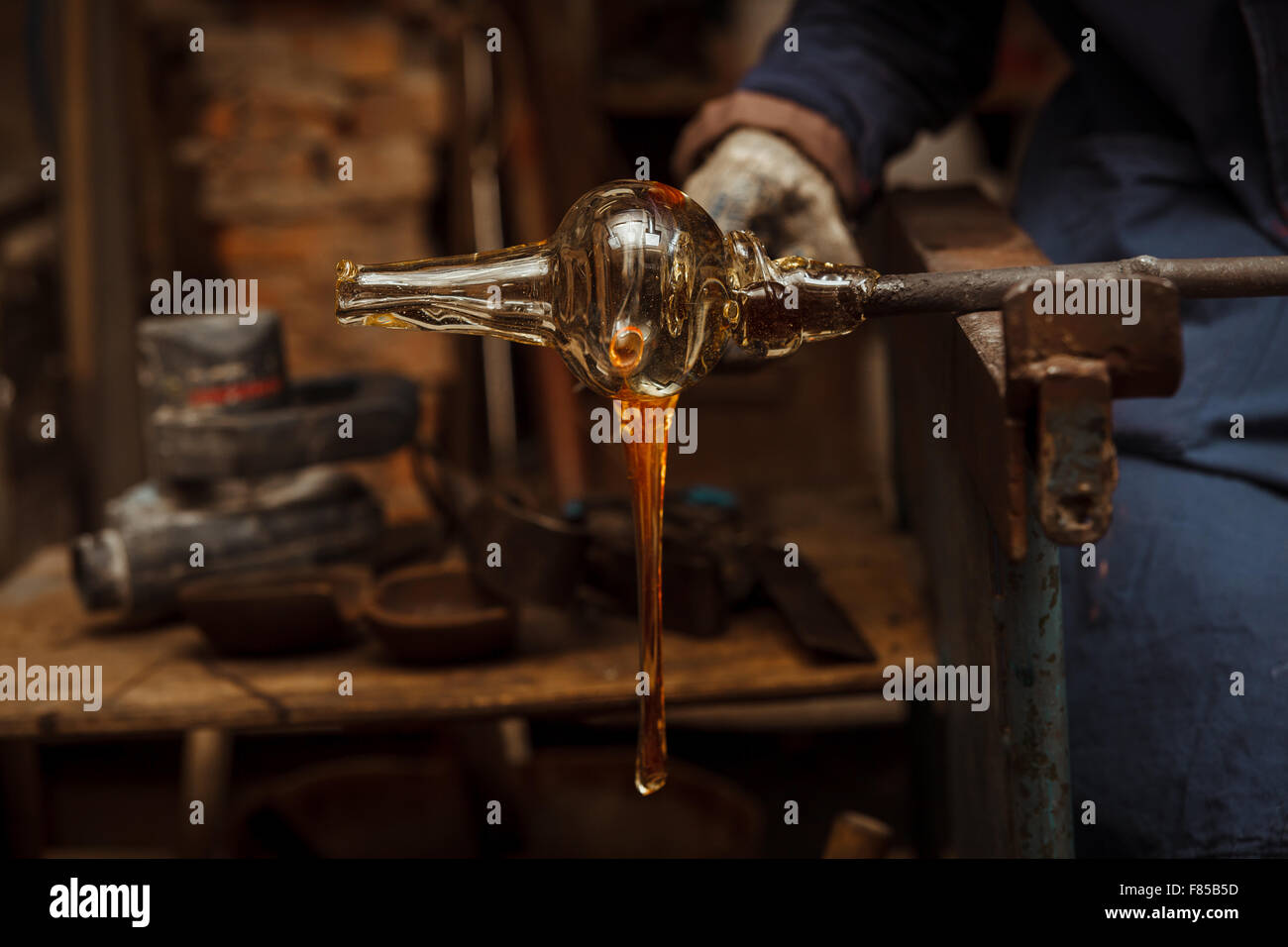 Glass Artist in her workshop making glassware Stock Photo - Alamy