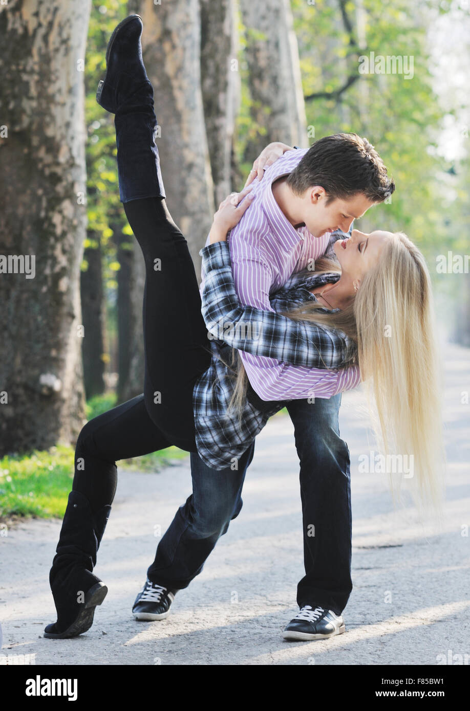 happy young romantic couple in love dance outdoor at spring season on ...