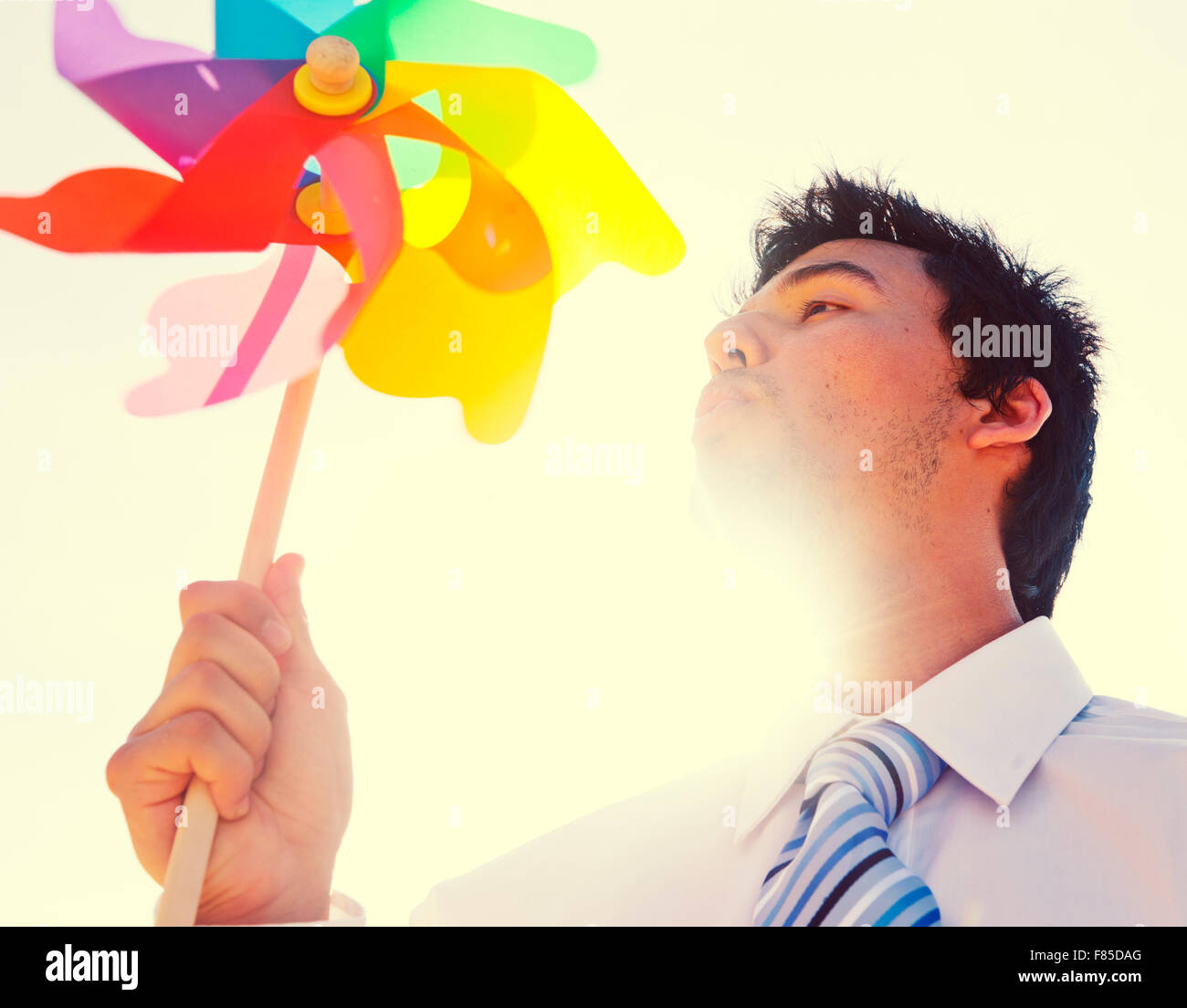 Businessman Blowing Wind Summer Power Energy Concept Stock Photo - Alamy