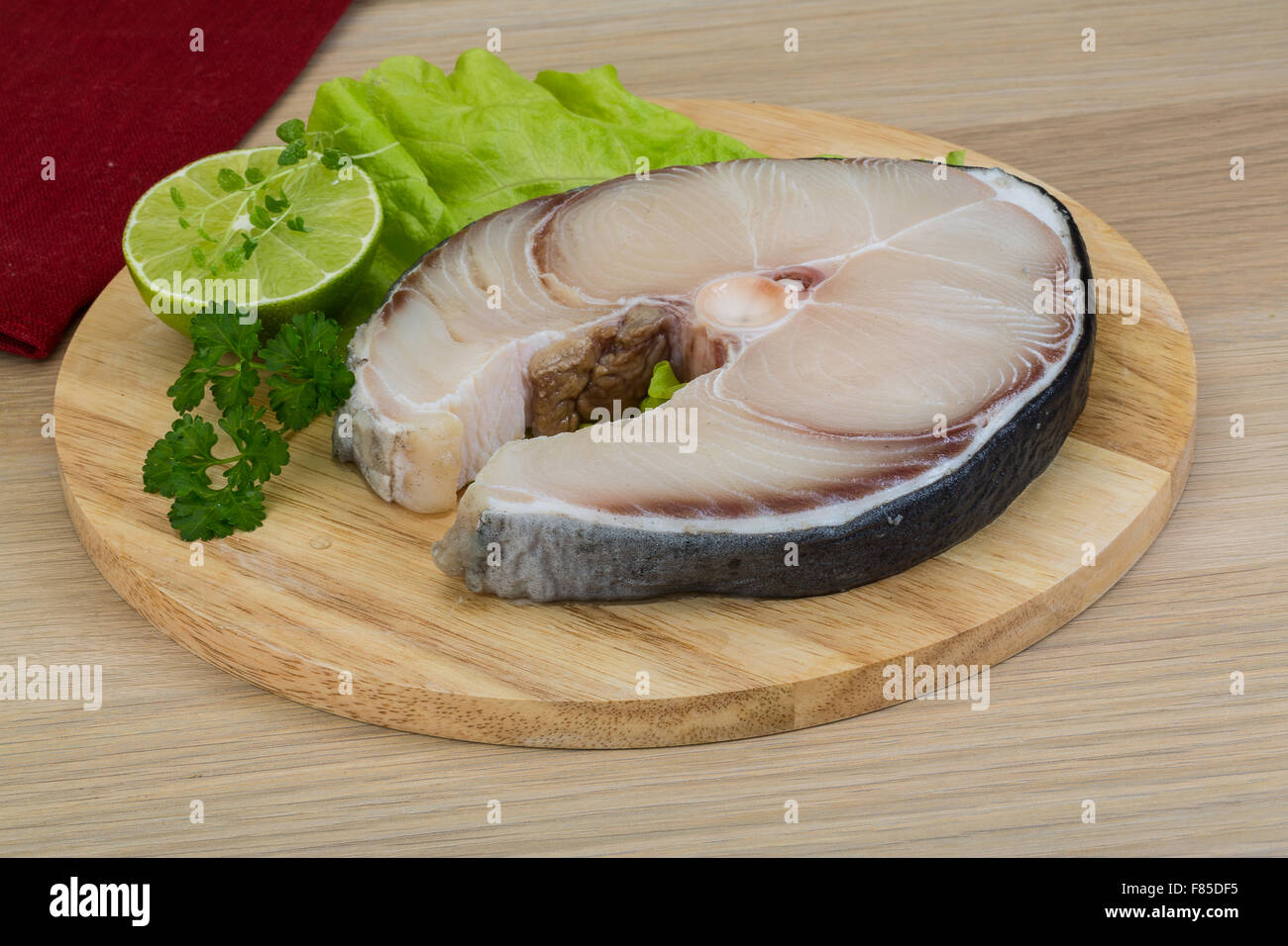 Raw blue shark steak with salad leaves and lime Stock Photo - Alamy