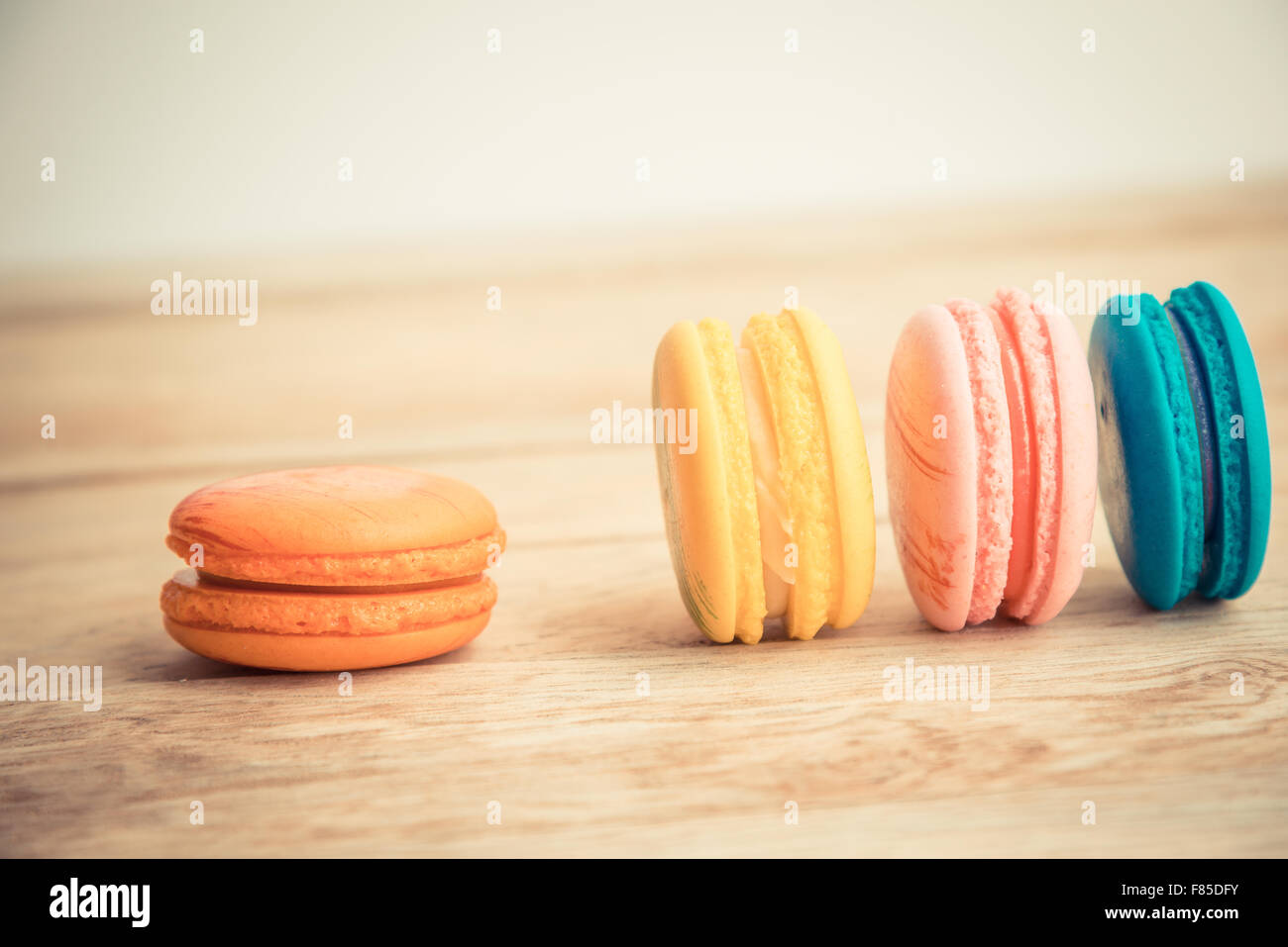 Colorful macaron on wooden floor in Vintage style 3 Stock Photo - Alamy