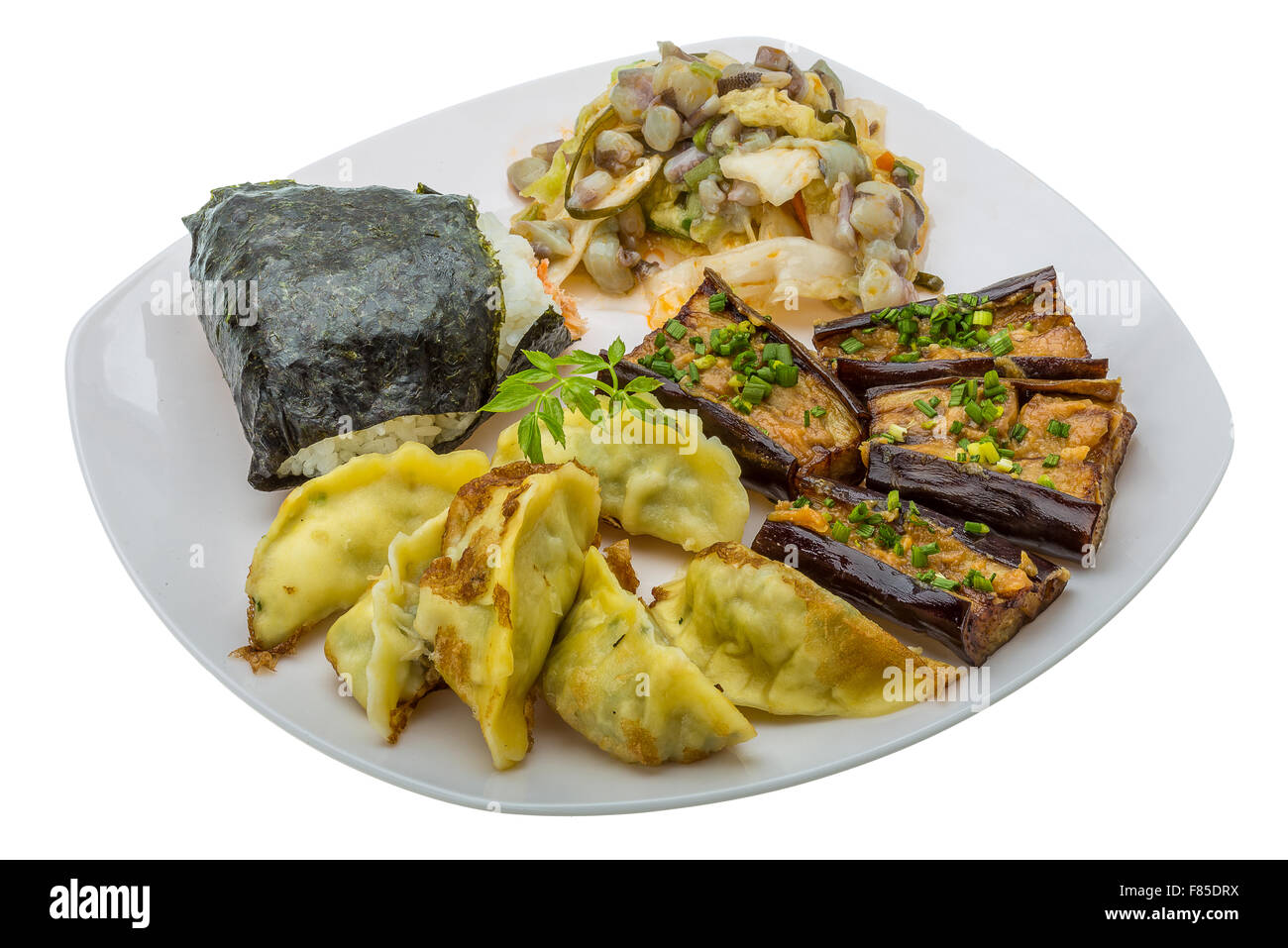 Japan traditional food - rice ball, gyoza, eggplant and octopus salad ...