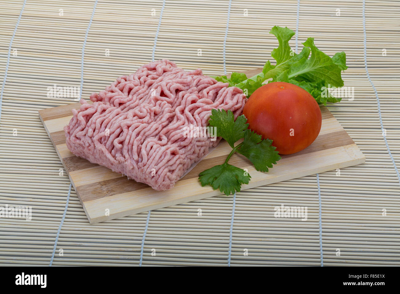 Raw minced pork meat on the desk with herbs Stock Photo - Alamy