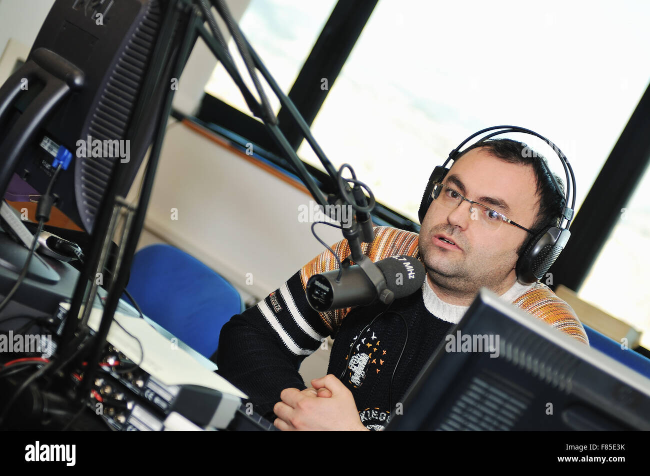 radio station dj reading news and info Stock Photo - Alamy