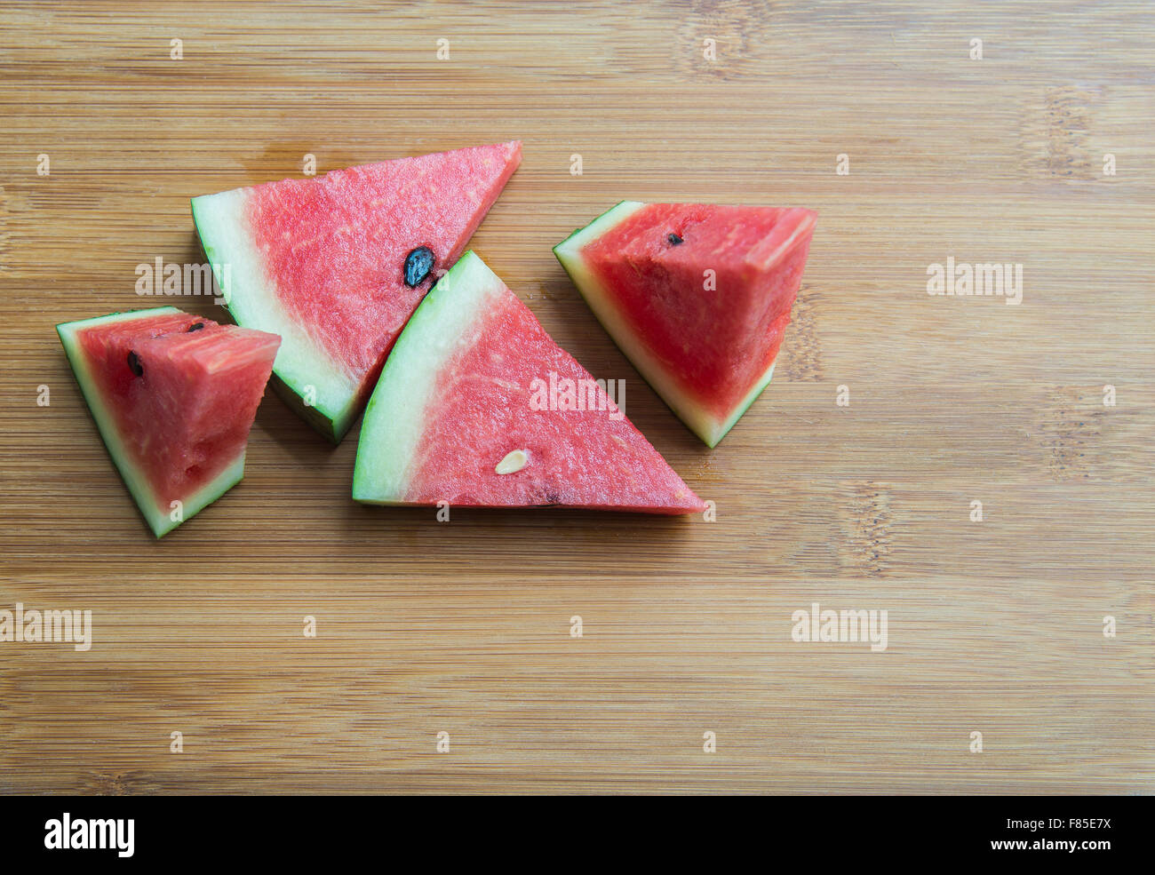 Piece of Water melon on wooden chopping block 2 Stock Photo - Alamy