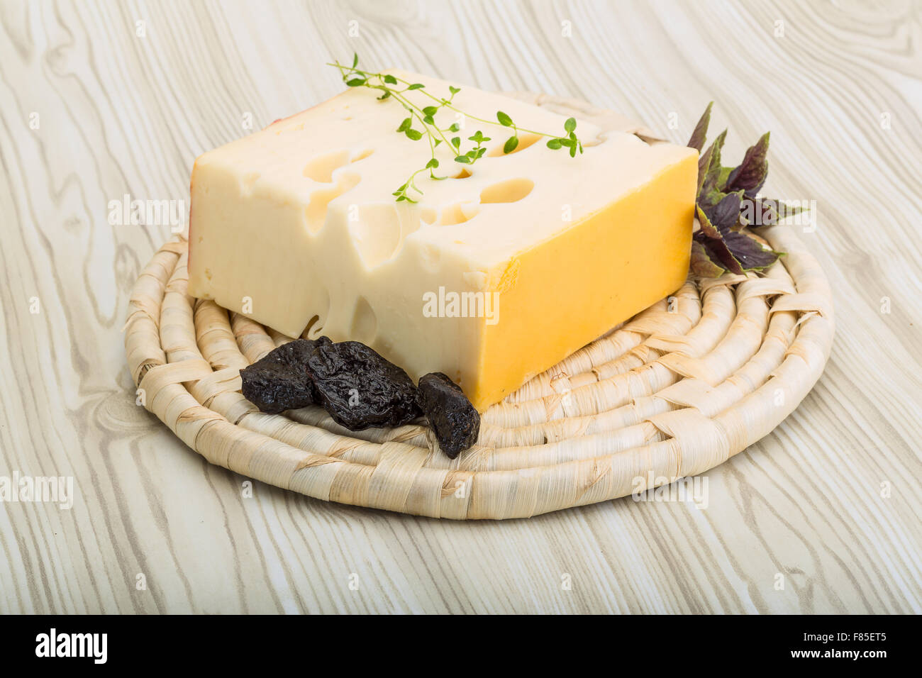Yellow Cheese maasdam - with thyme and basil Stock Photo - Alamy