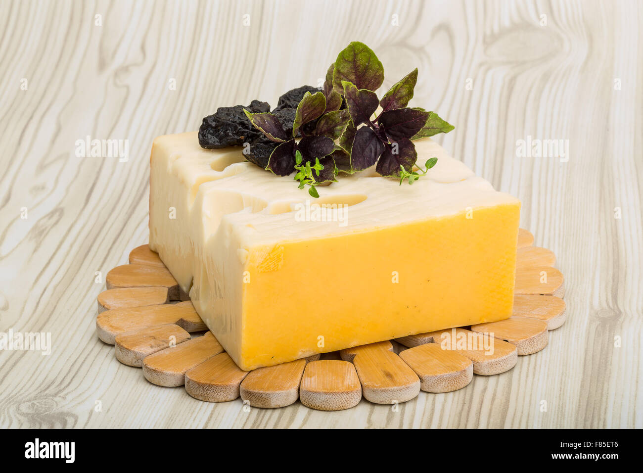 Yellow Cheese maasdam - with thyme and basil Stock Photo - Alamy