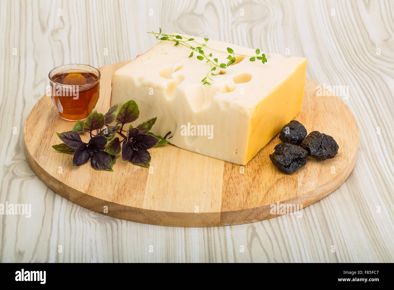Yellow Cheese maasdam - with thyme and basil Stock Photo - Alamy