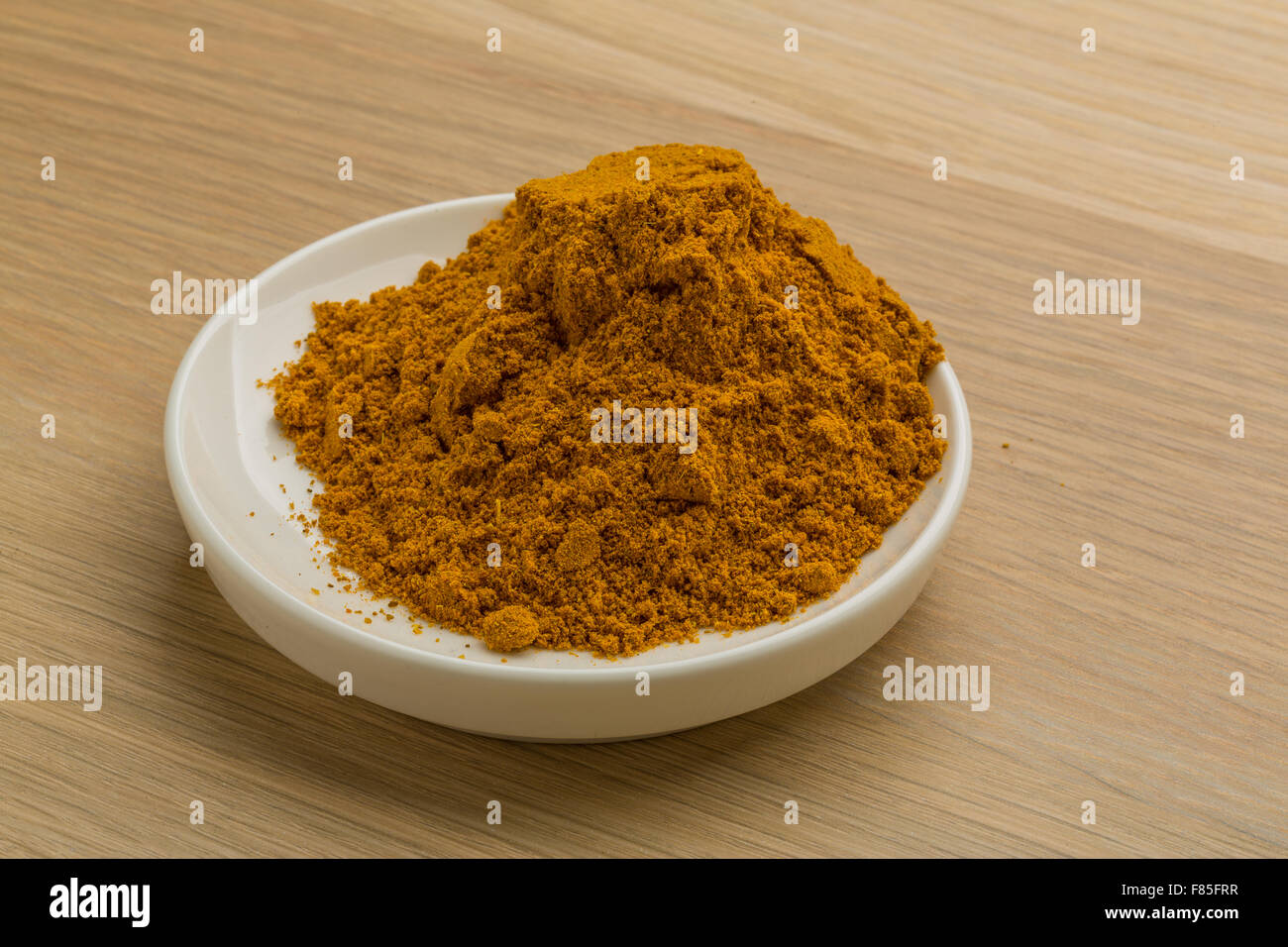 Curry powder in the bowl Stock Photo - Alamy