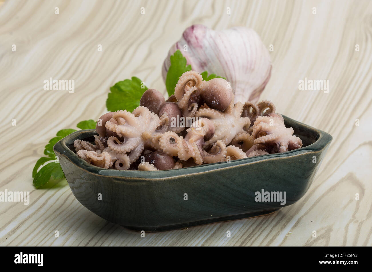 Boiled octopus - mini seafood in the bowl Stock Photo - Alamy